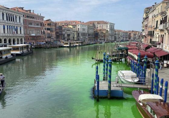Authorities launch probe after canal water in Venice turns fluorescent ...